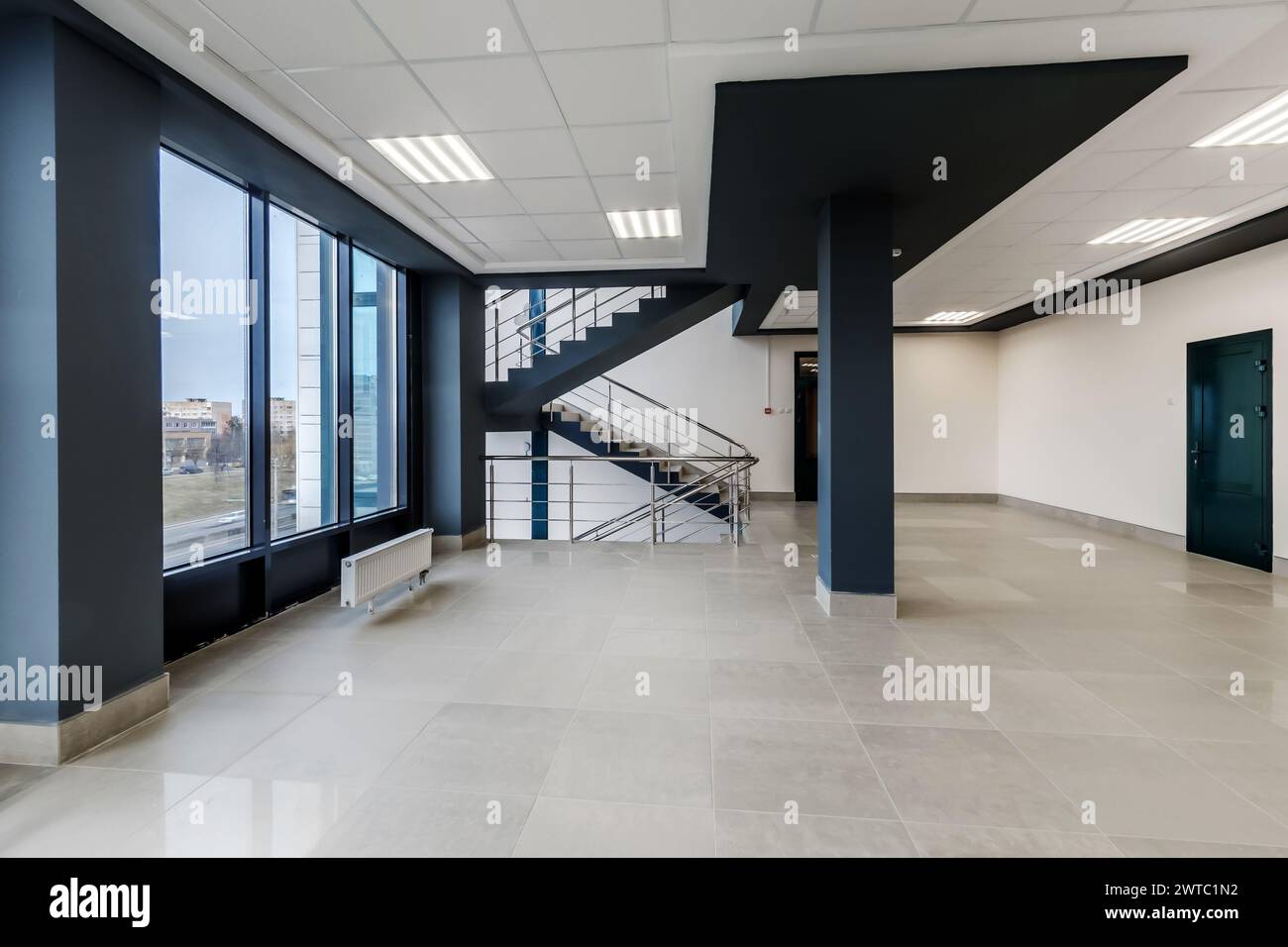 panorama view in empty modern hall with columns, doors , stairs and ...