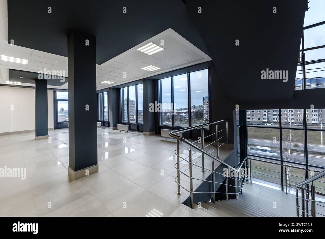 panorama view in empty modern hall with columns, doors , stairs and ...