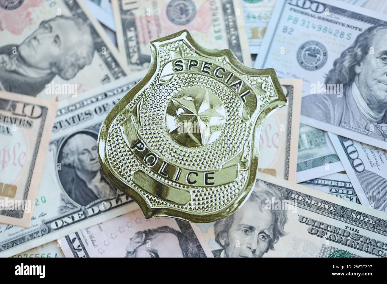 KYIV, UKRAINE - MARCH 9, 2024 US Special Police badge on many US dollar ...