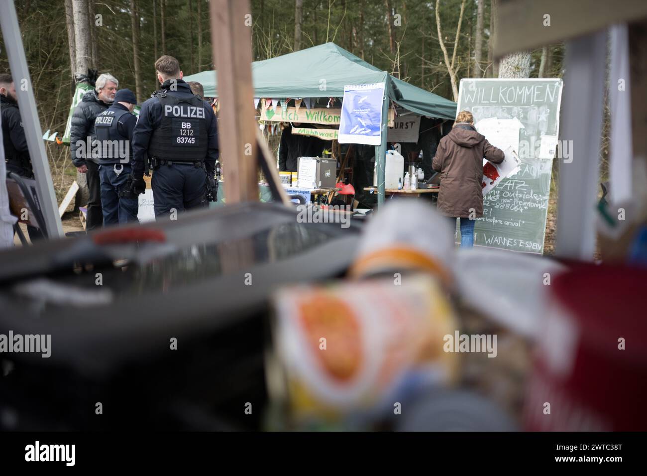17 March 2024, Brandenburg, Grünheide: Police officers stand at the communal kitchen and the ...