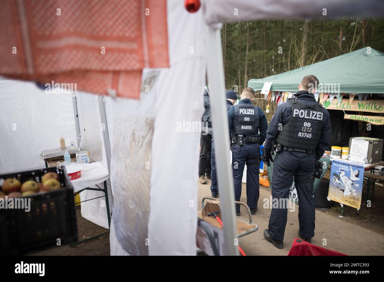 17 March 2024, Brandenburg, Grünheide: Police officers stand at the communal kitchen and the ...