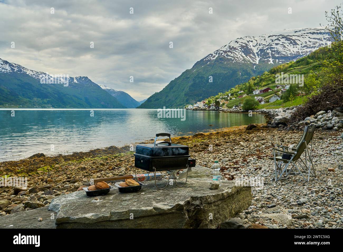 beautiful tranquil landscape at the beach of Hardanger fjord with calm ...