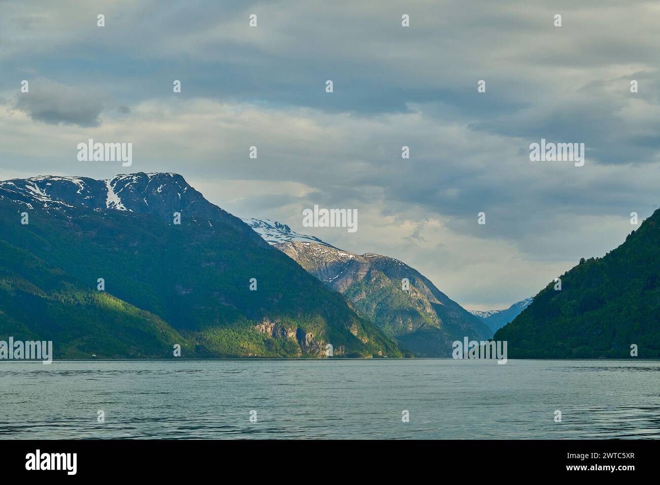 beautiful tranquil landscape at the beach of Hardanger fjord with calm ...