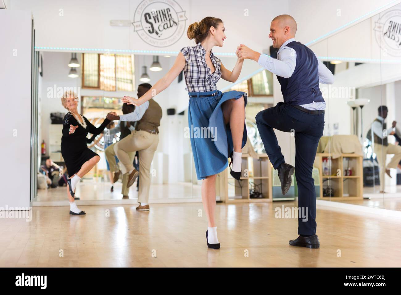 Woman and man dancing swing in studio Stock Photo - Alamy