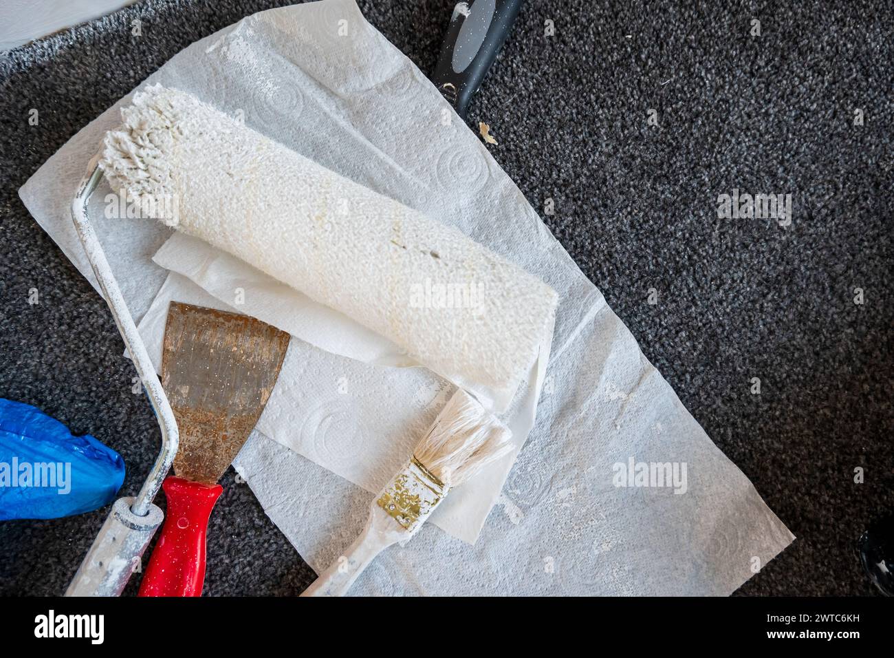 Paint roller and brush on paper tissue during home renovation Stock ...
