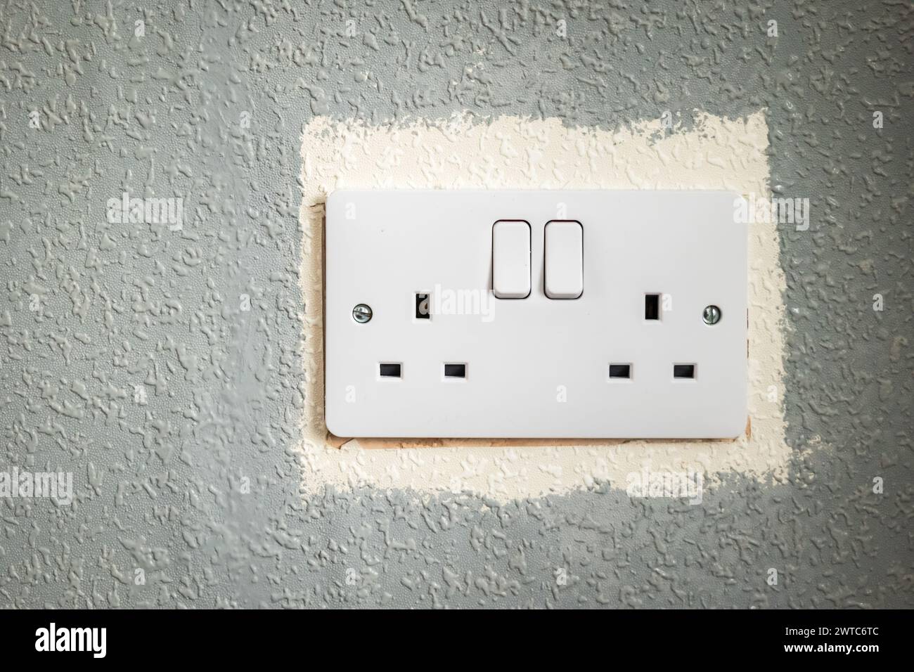 light switch on painted wallpaper wall texture closeup during home ...
