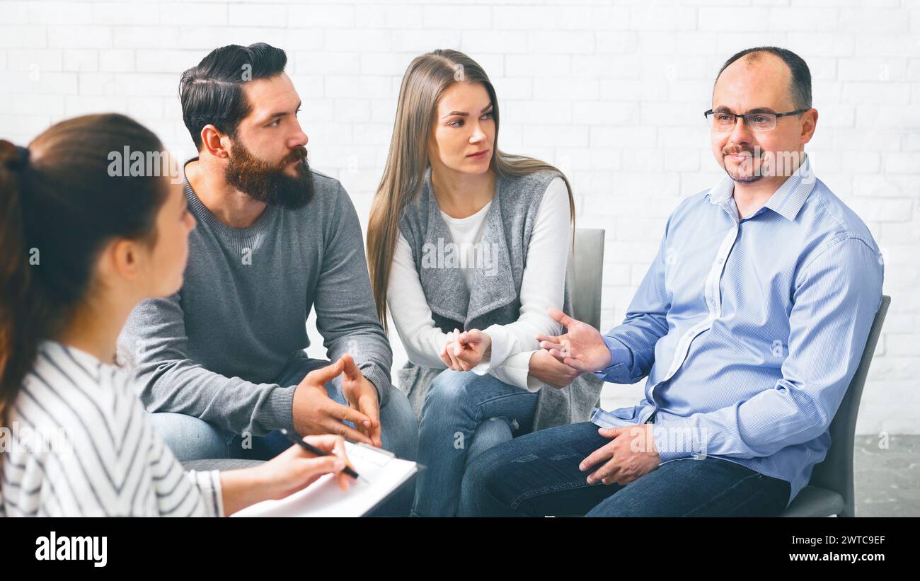 Group of patients talking at therapy session Stock Photo - Alamy