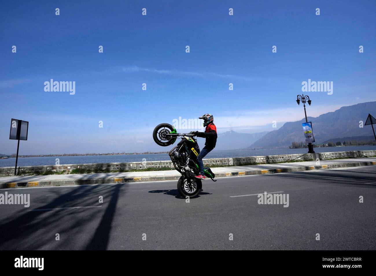 A motorcyclist performs a manoeuvre at a motorsport event organized to boost adventure tourism ...