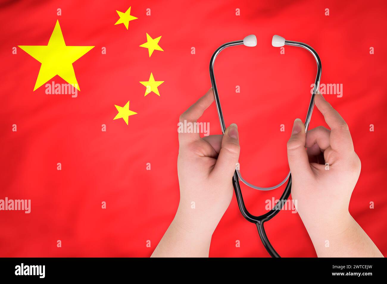 Medical stethoscope in hands (close-up) against the background of the ...