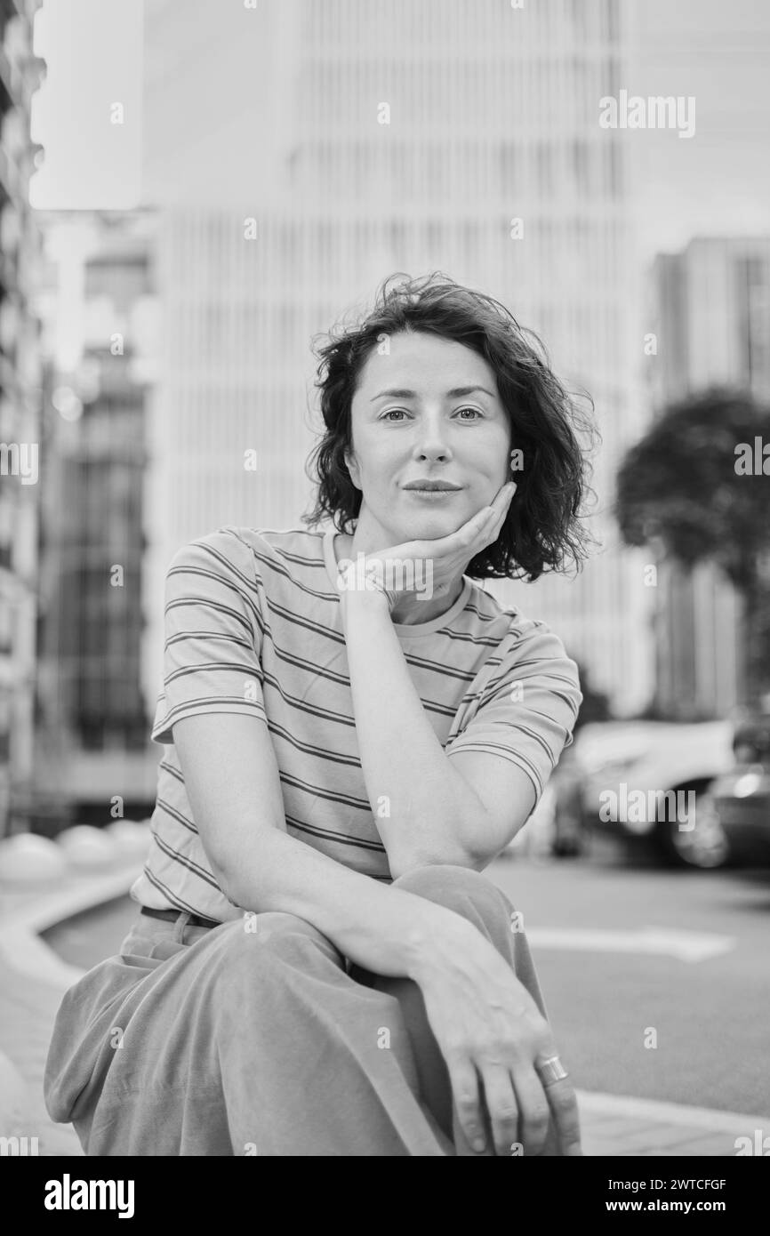 Happy young woman walking outside. One confident girl walks outdoors in ...