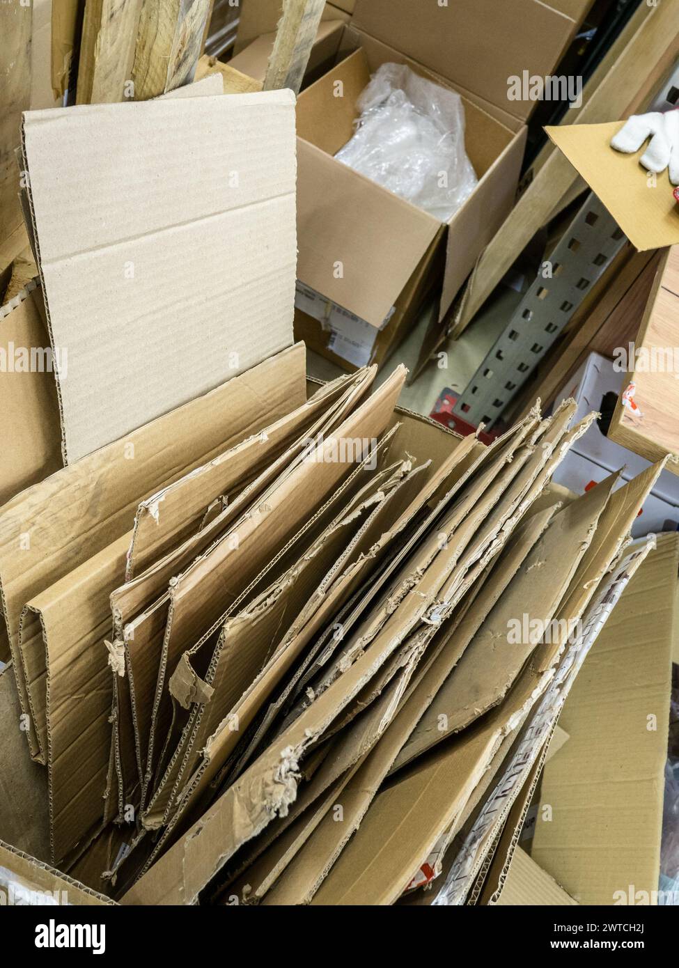 cardboard sheets from disassembled boxes in warehouse Stock Photo - Alamy