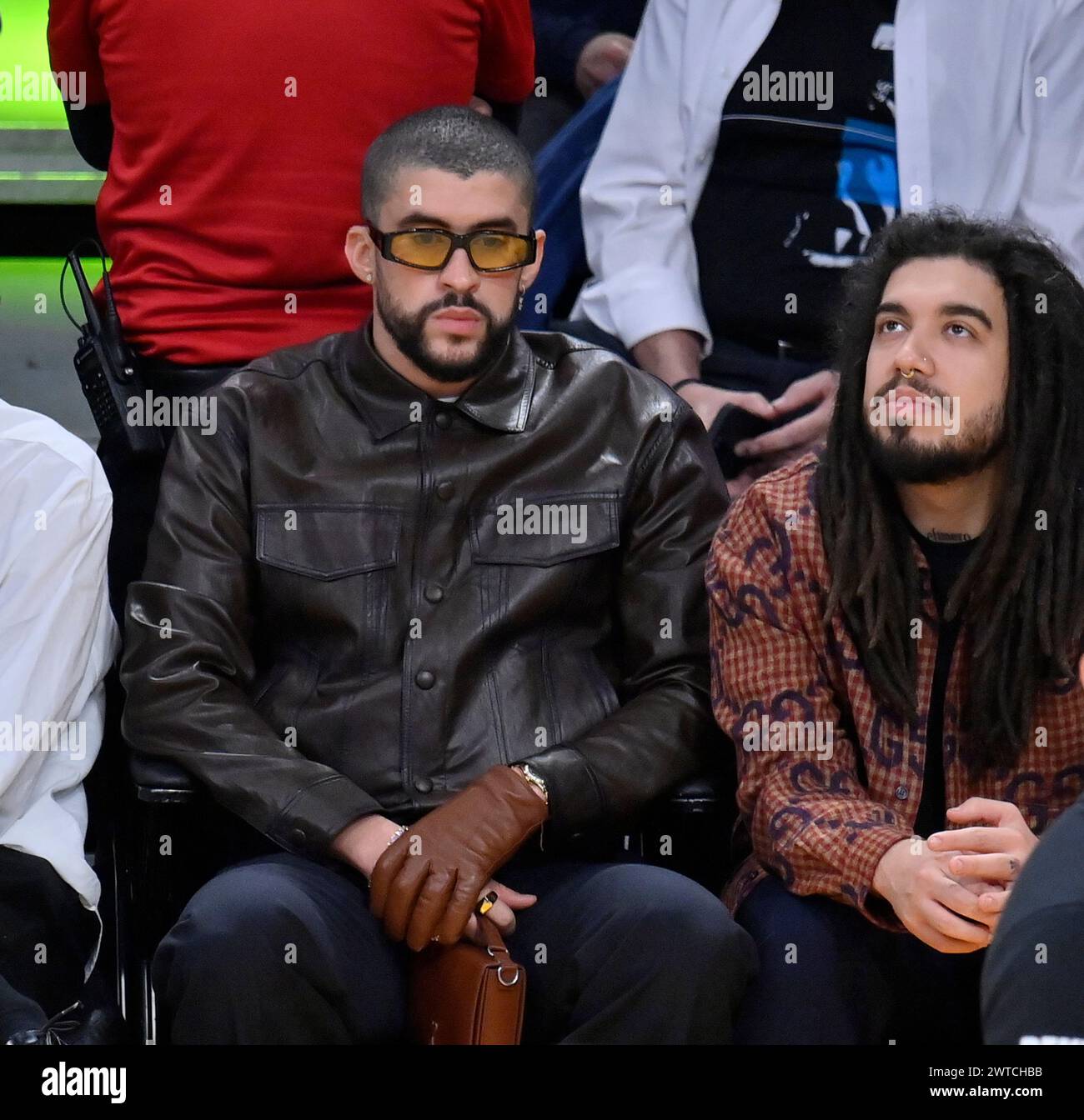 Los Angeles, United States. 16th Mar, 2024. Bad Bunny sits court side ...