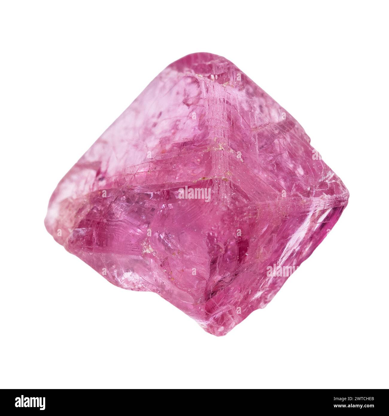 specimen of natural rough pink spinel crystal cutout on white ...