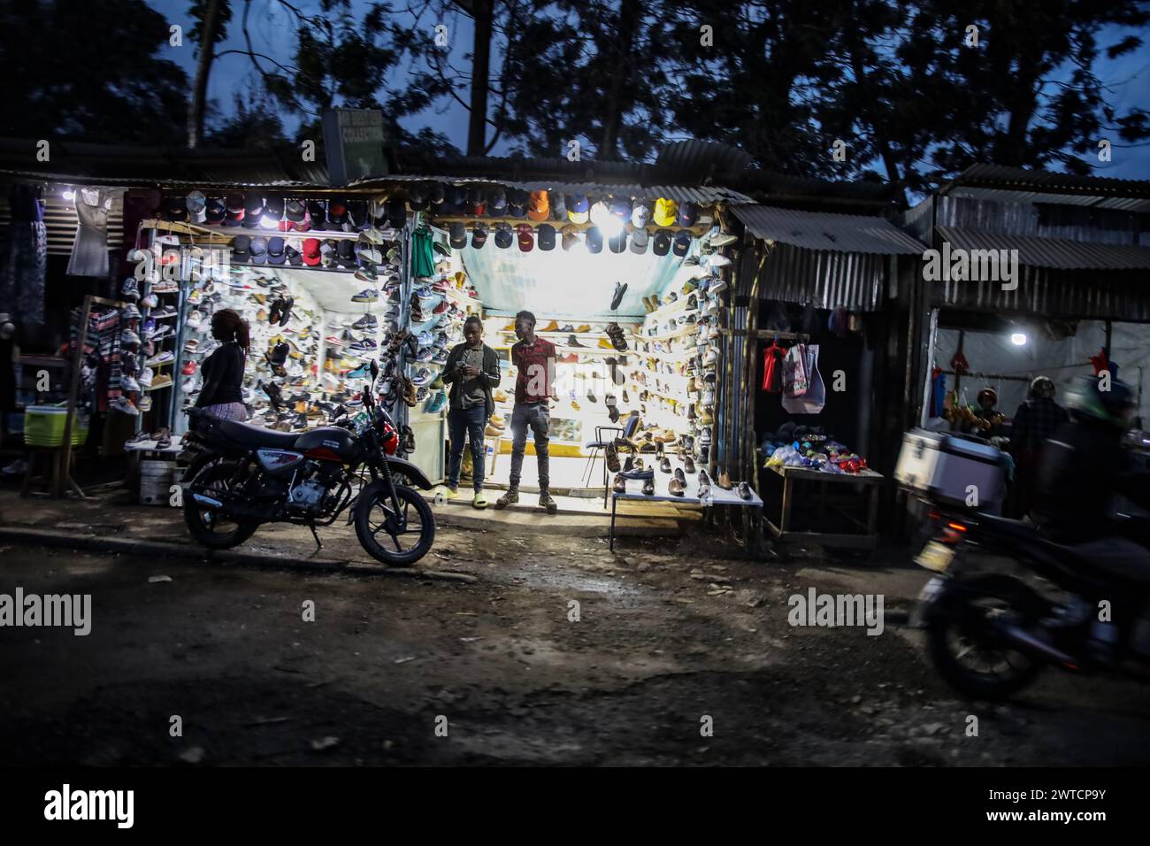 Hawkers making their late evening sales to residents in Kibera Slum ...