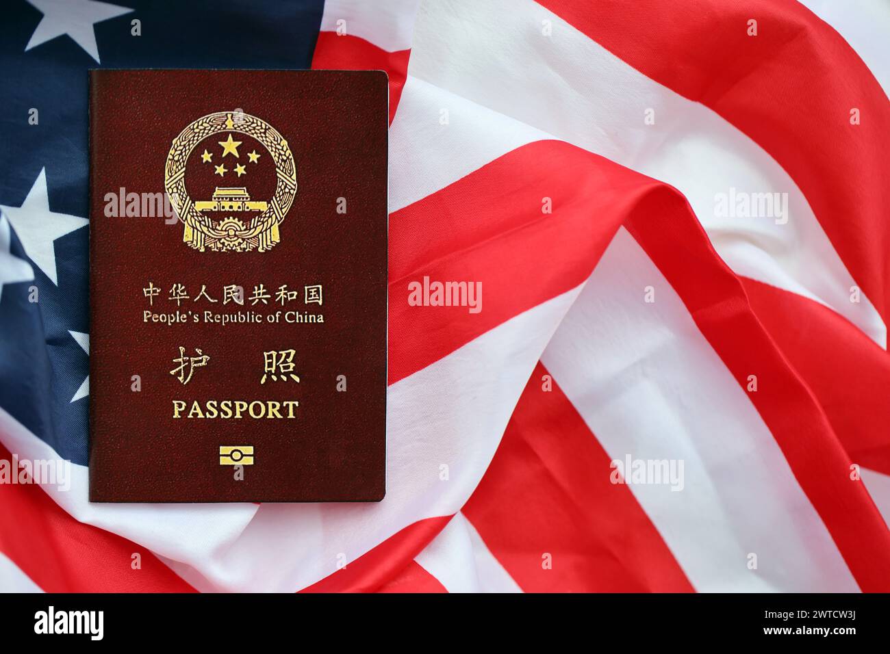 Red passport of People Republic of China on United States flag. PRC ...