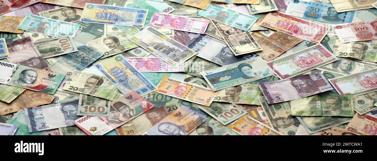 Many banknotes of different currency. Background of big amount of ...