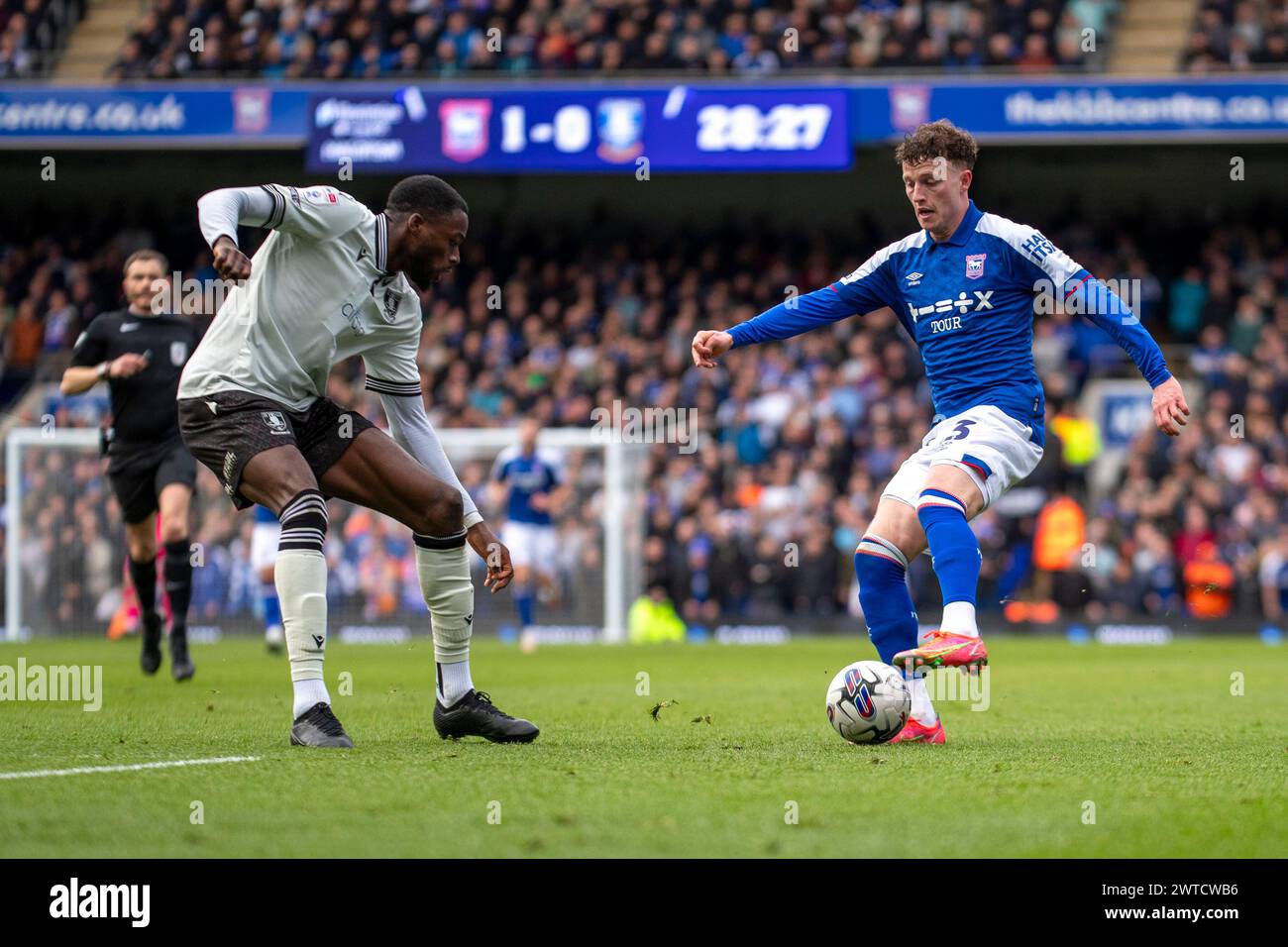 Dominic Iorfa of Sheffield Wednesday puts pressure on Nathan Broadhead ...