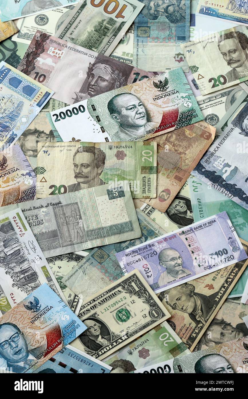 Many banknotes of different currency. Background of big amount of ...