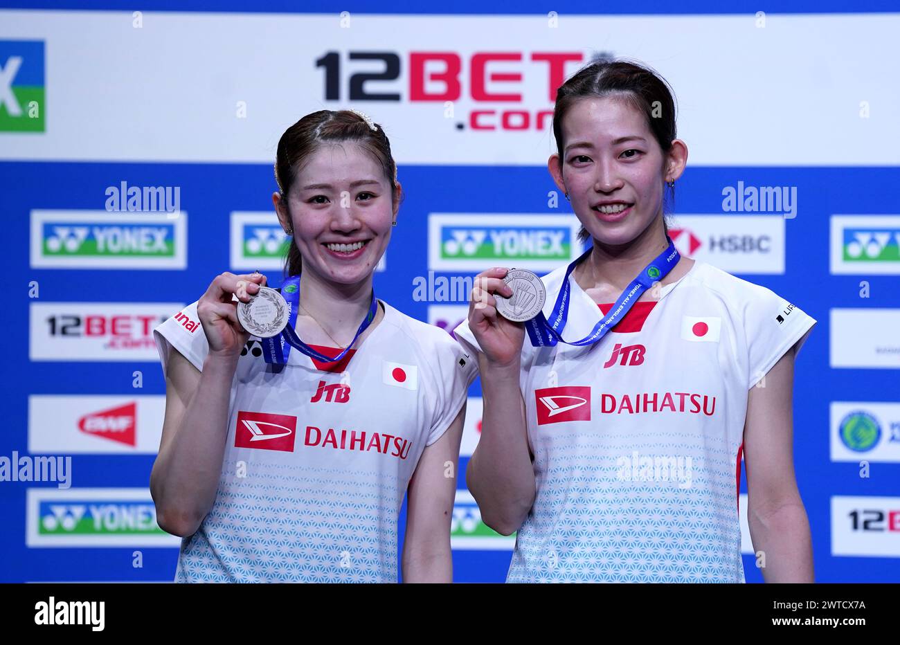 Japan's Nami Matsuyama and Chiharu Shida pose with their runners up medals following defeat ...