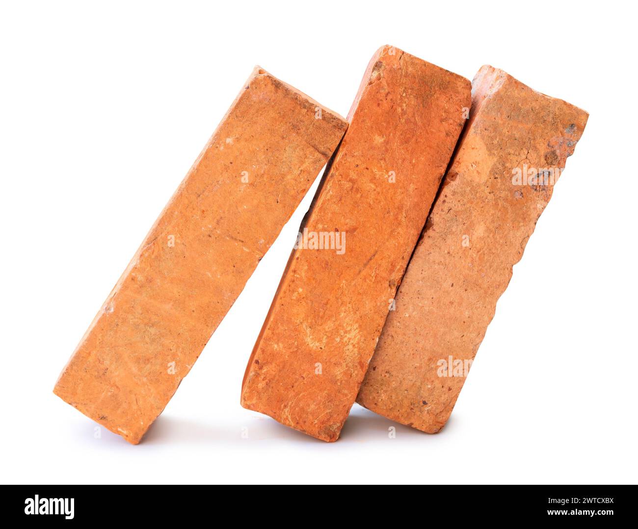 Side view of cracked old red or orange bricks in stack is isolated on ...