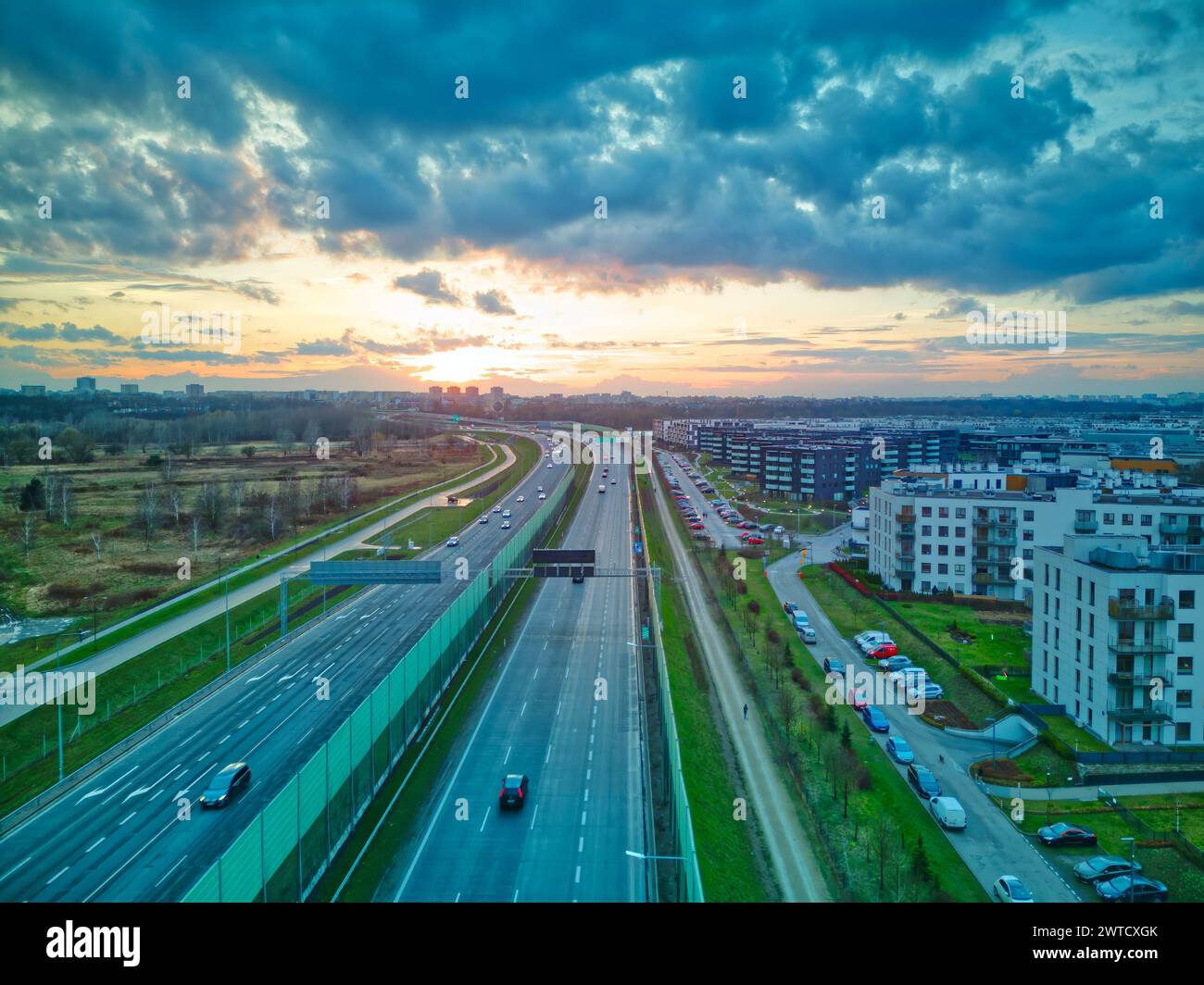 Aerial, vertical view of the expressway and fast-driving cars during a ...