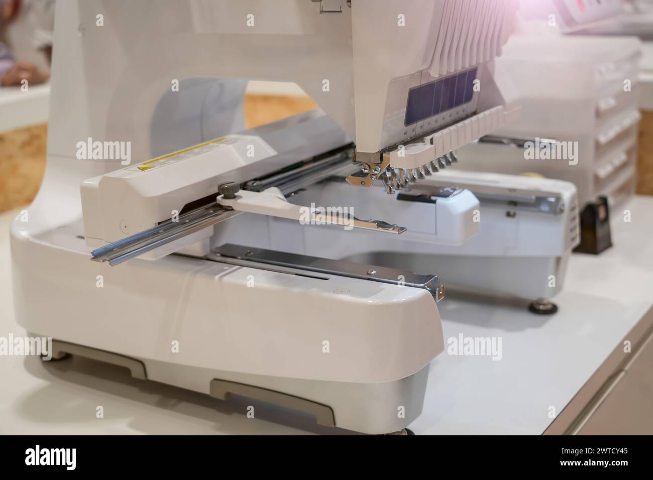 Automatic sewing machine for embroidering patterns and designs on ...