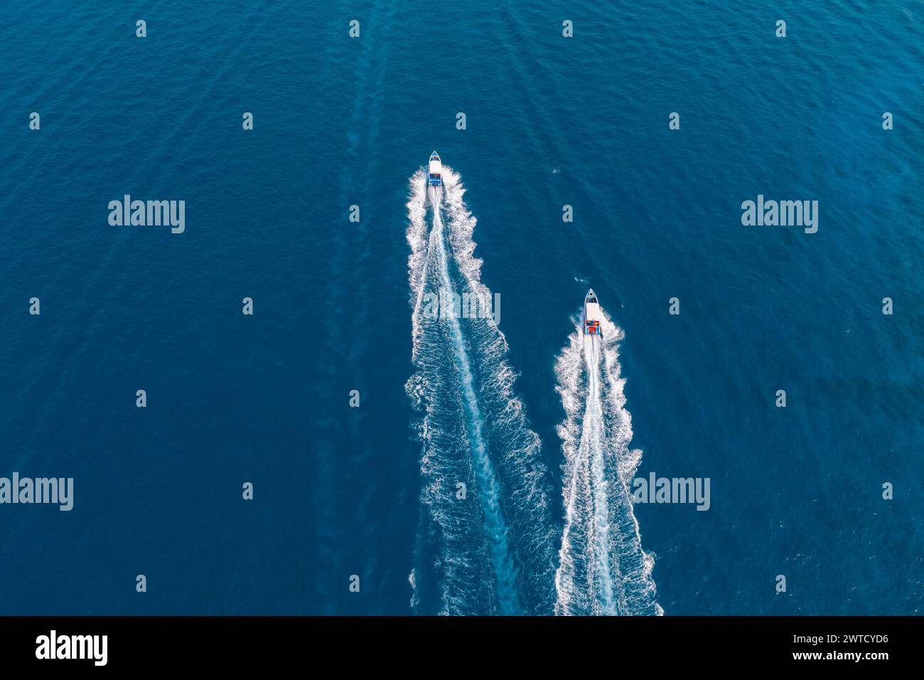Top aerial view of pair two boat sailing to the blue sea. Drone view of ...