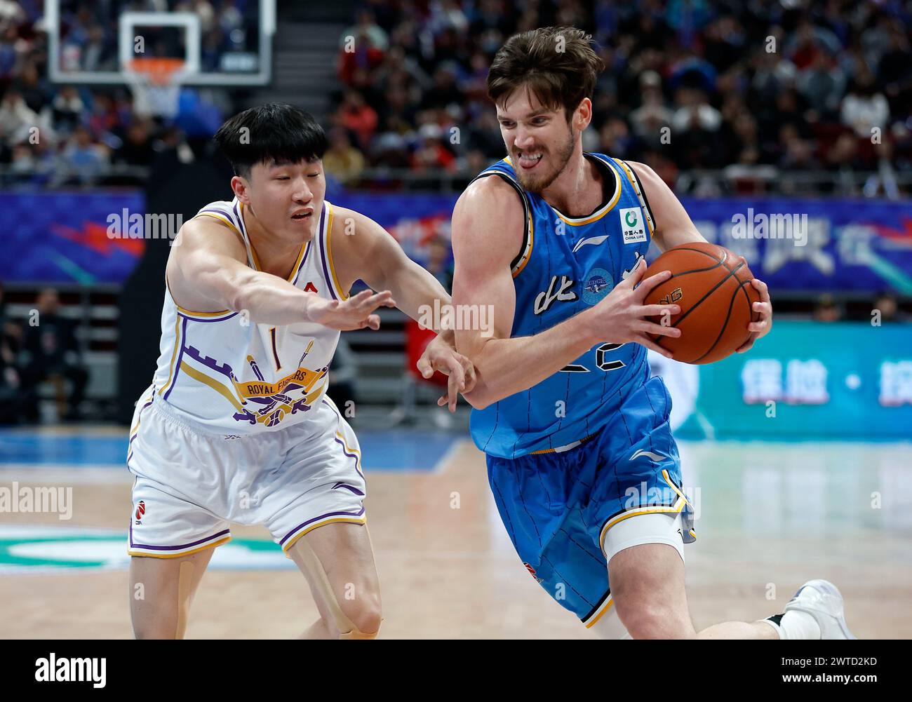 Beijing, China. 17th Mar, 2024. Ty Jacob Leaf (R) of Beijing Ducks ...