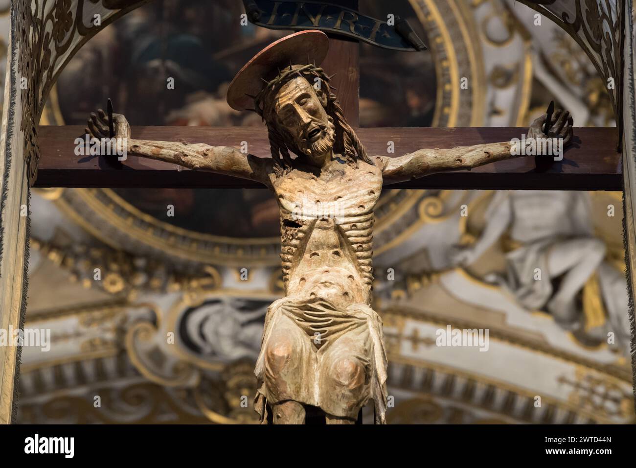 Gothic wooden crucifix from XIV century in Lombard Romanesque Basilica ...