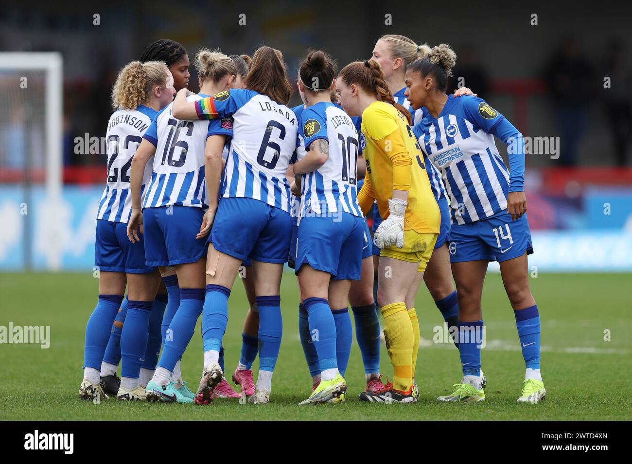 Brighton and Hove Albion players form a huddle before the second half ...