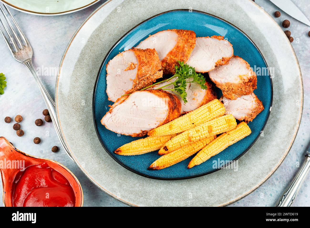 Pork fillet or tenderloin grilled with baked corn. Top view Stock Photo ...