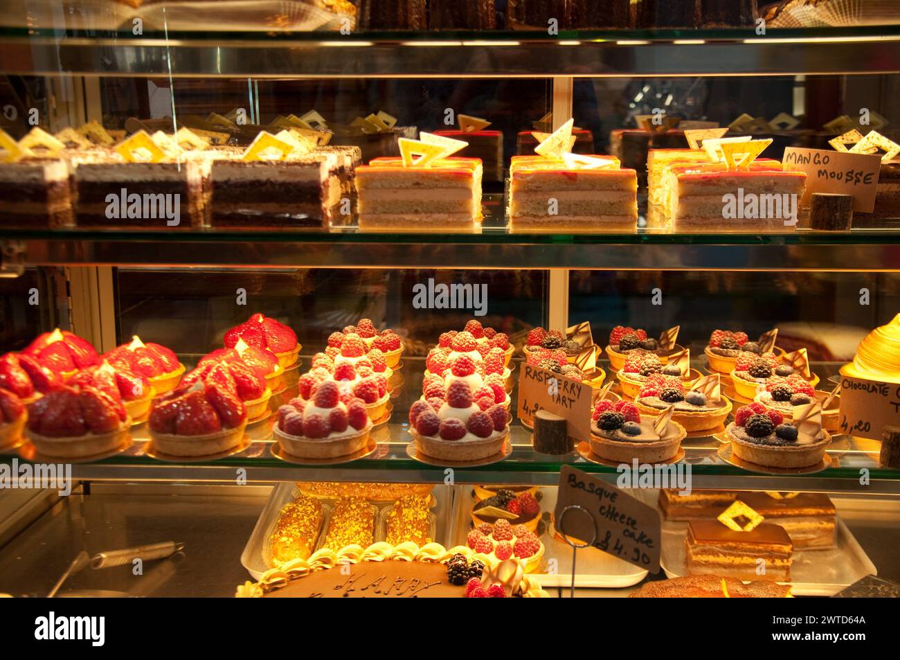 Cake shop window, Brixton Village, Brixton, London, UK - marangues; fruit cakesl fruit tarts ...