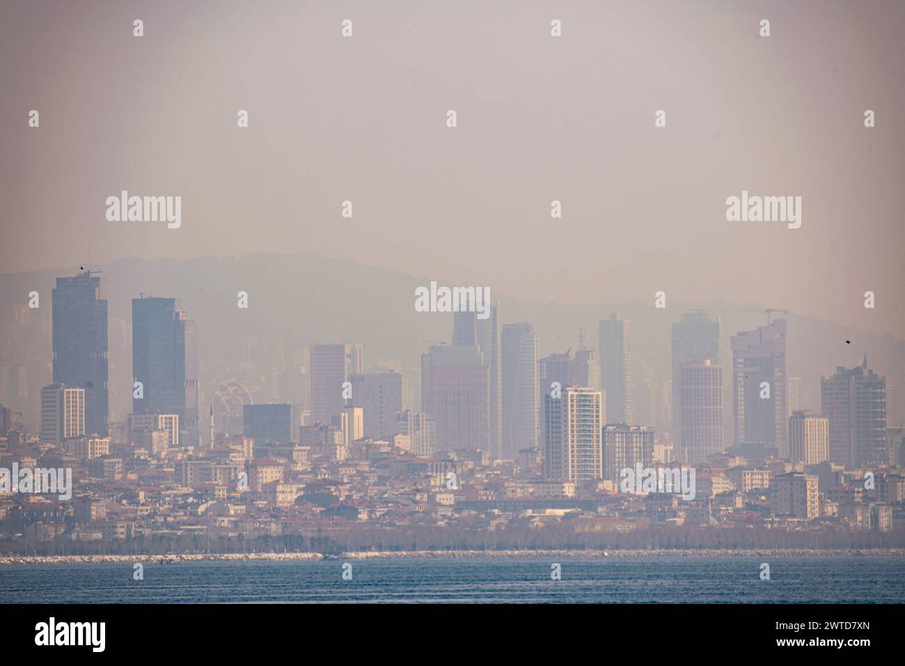 Smog and pollution on a sunnyy day amongst the skyscrapers and modern ...