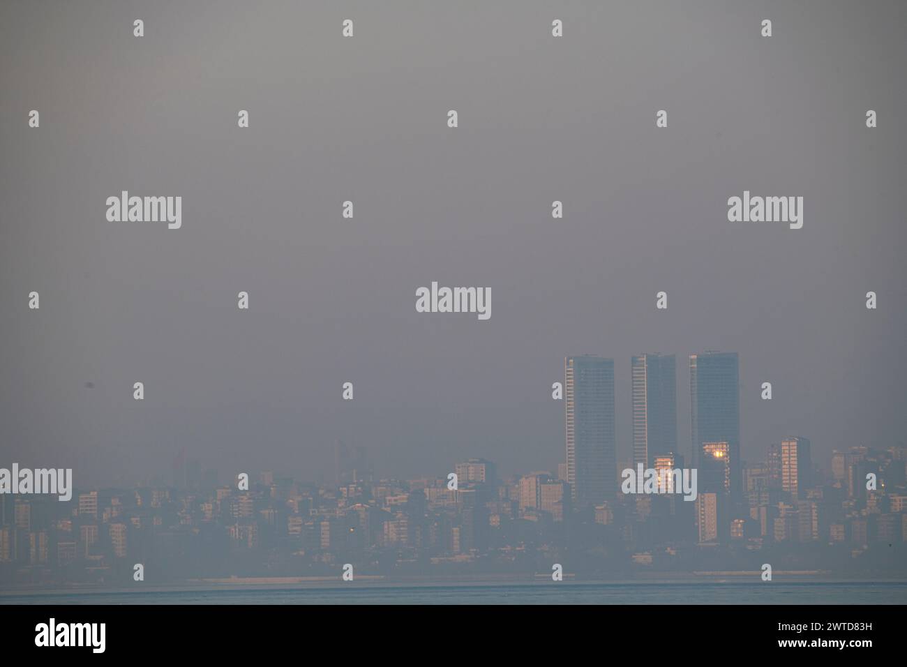 Smog and pollution on a sunnyy day amongst the skyscrapers and modern ...