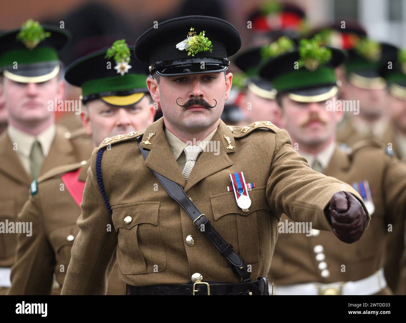 Aldershot, UK. March 17th, 2024. Irish Guardsmen, wearing a sprig of ...