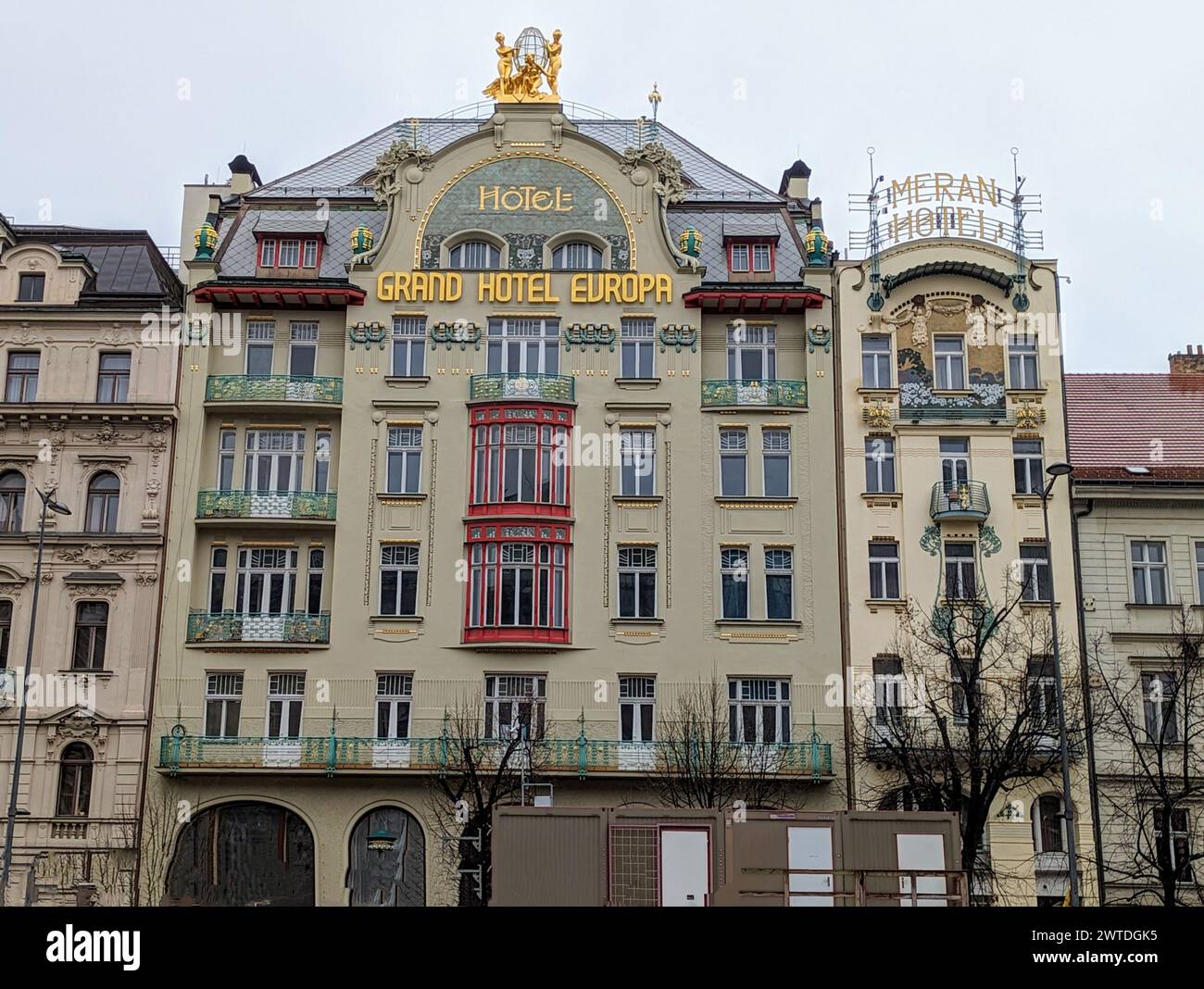 A structure with statues in front of skyscrapers in Prague, Czech ...