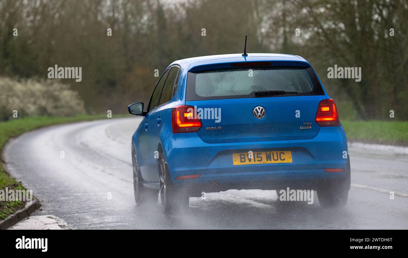 Milton Keynes,UK-Mar 17th 2024: 2015 blue Volkswagen Polo car driving ...