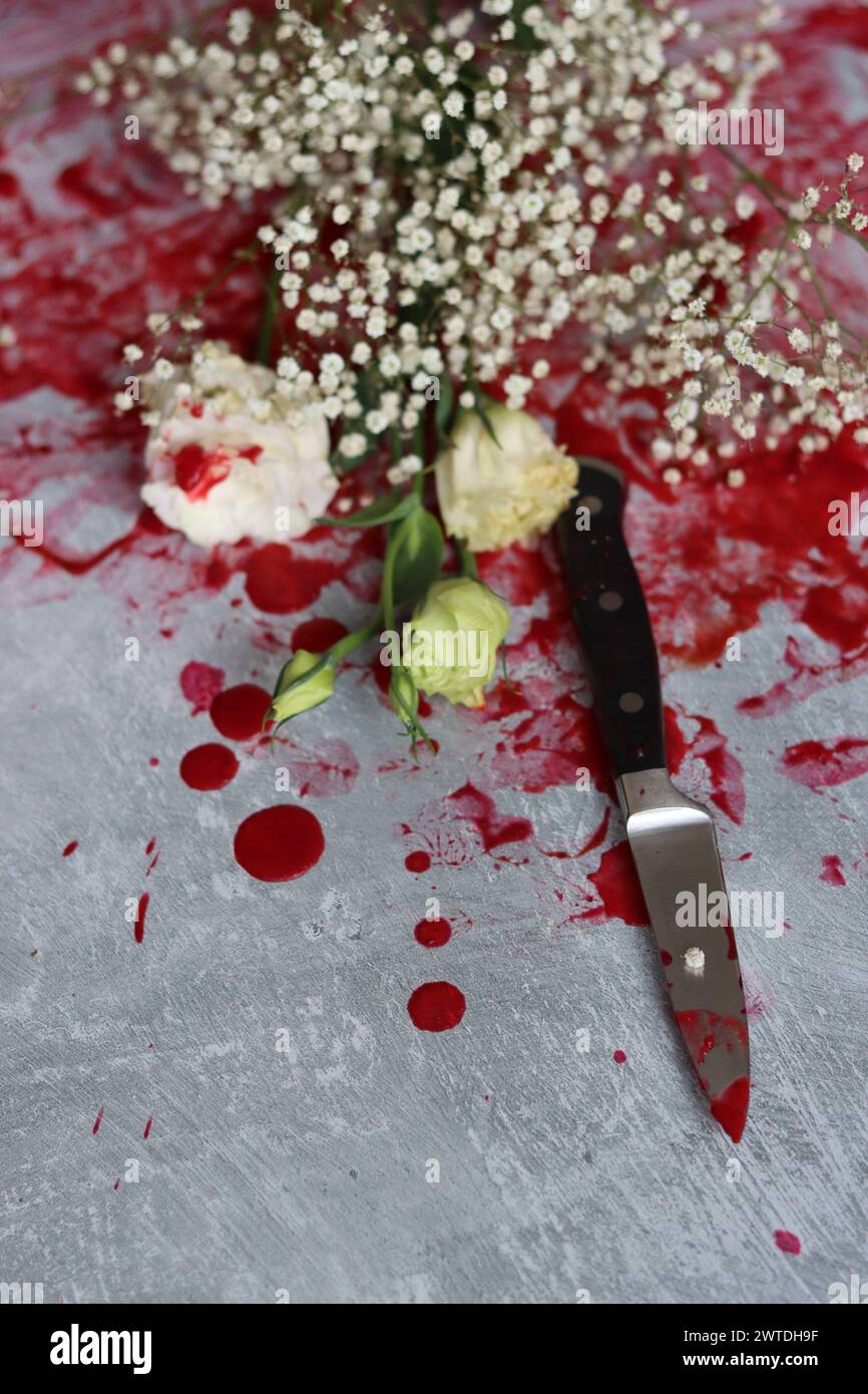Blood on white flowers. Messy scene with bloody roses Stock Photo - Alamy