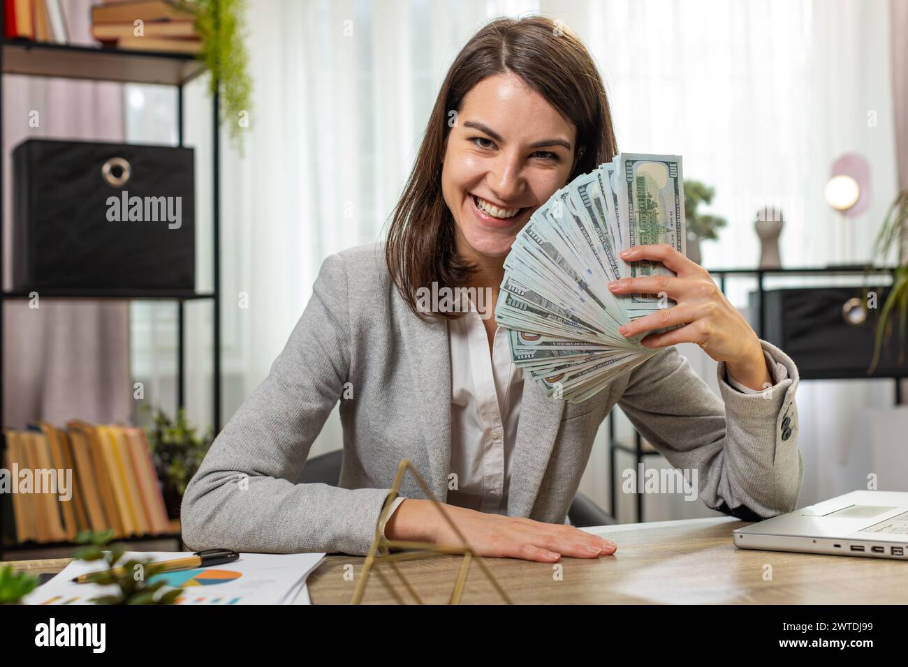 Smiling business woman counting cash money dollar checking salary enjoy ...