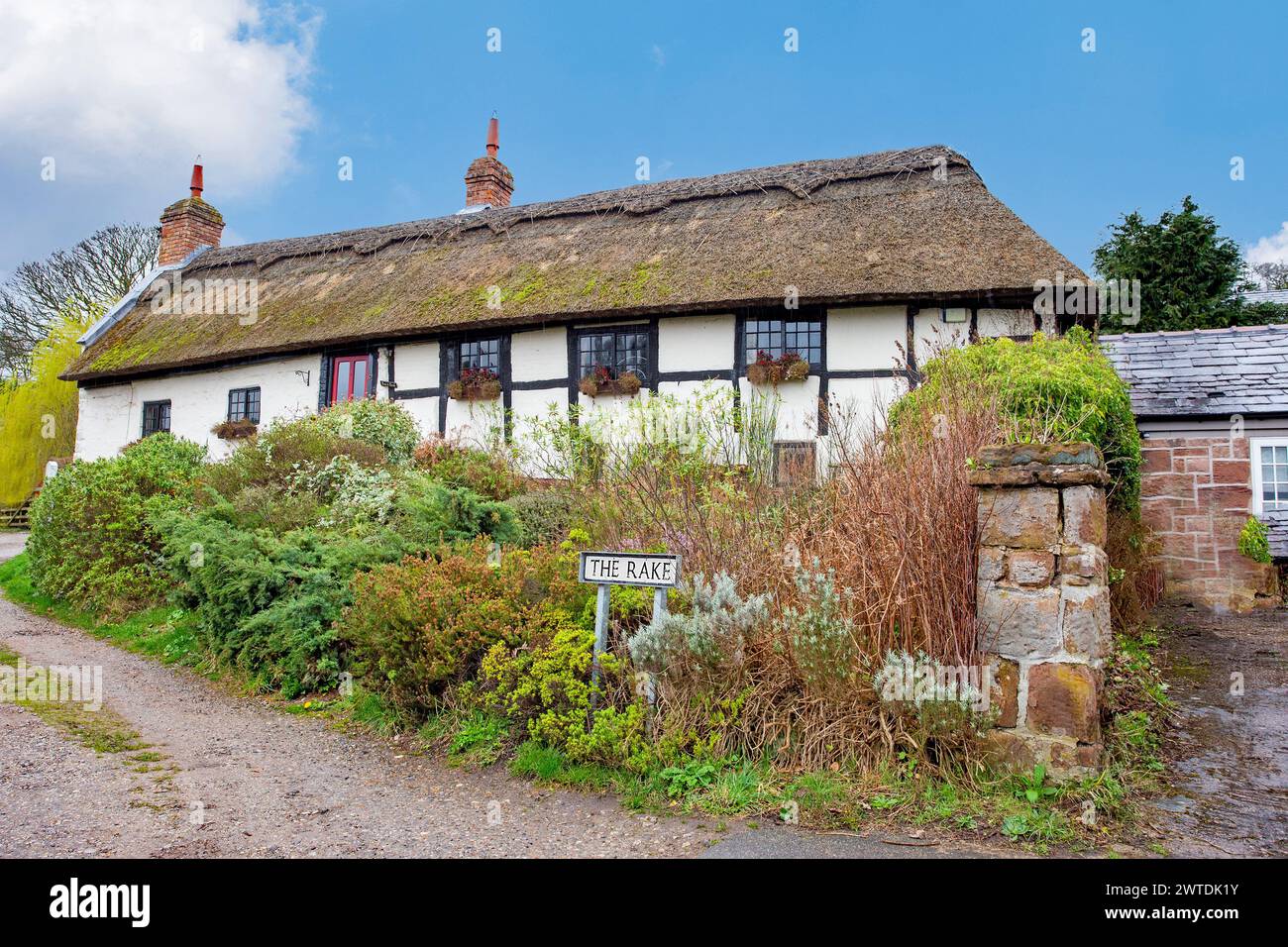 Traditional thatched country cottage in the Cheshire Wirral village of ...