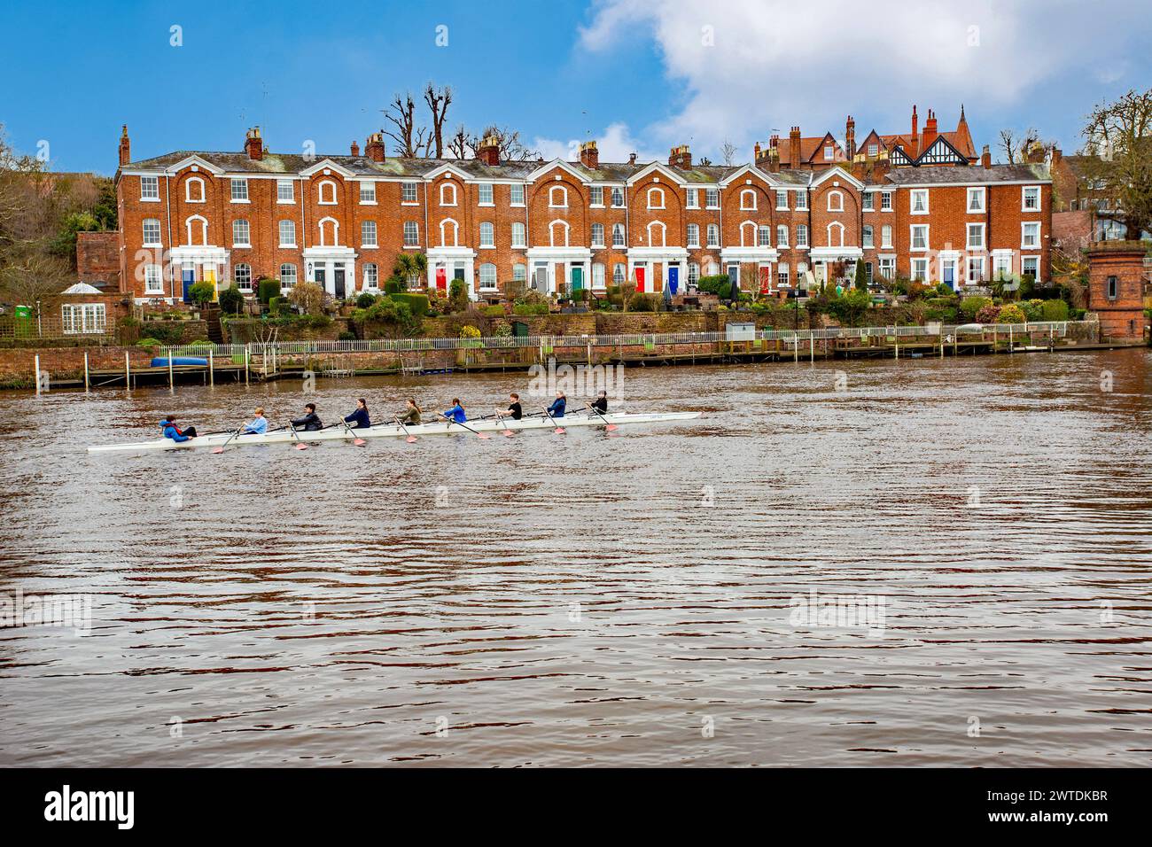 Rowers having rowing lessons on the river Dee as it flows past Deva ...