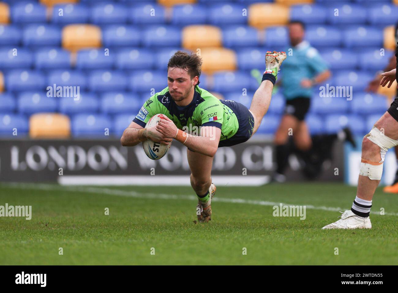 London, UK. 17th Mar, 2024. Adam Holroyd of Warrington Wolves scores a ...