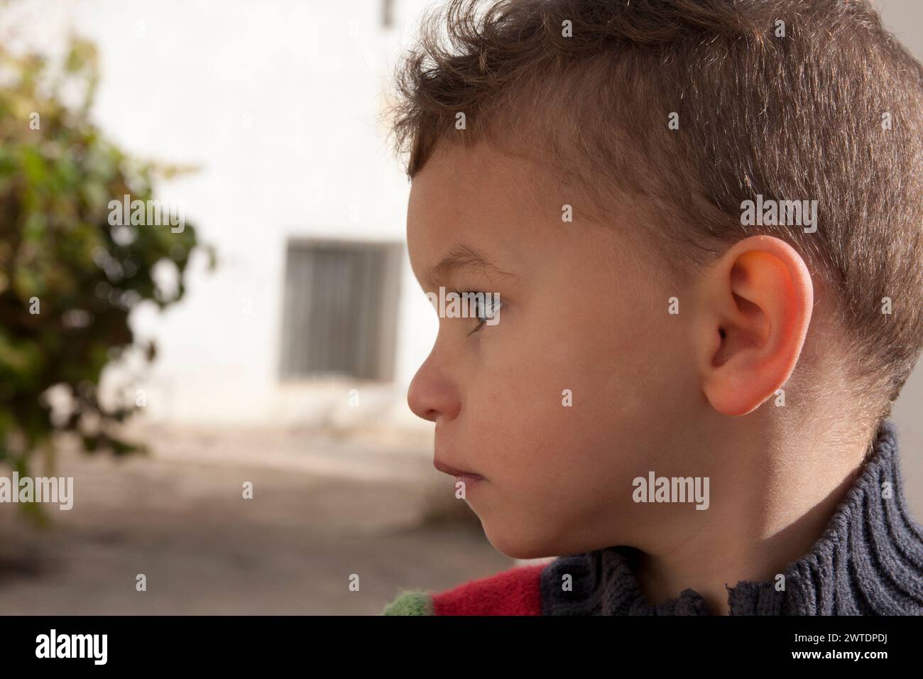moody little boy side profile Stock Photo - Alamy