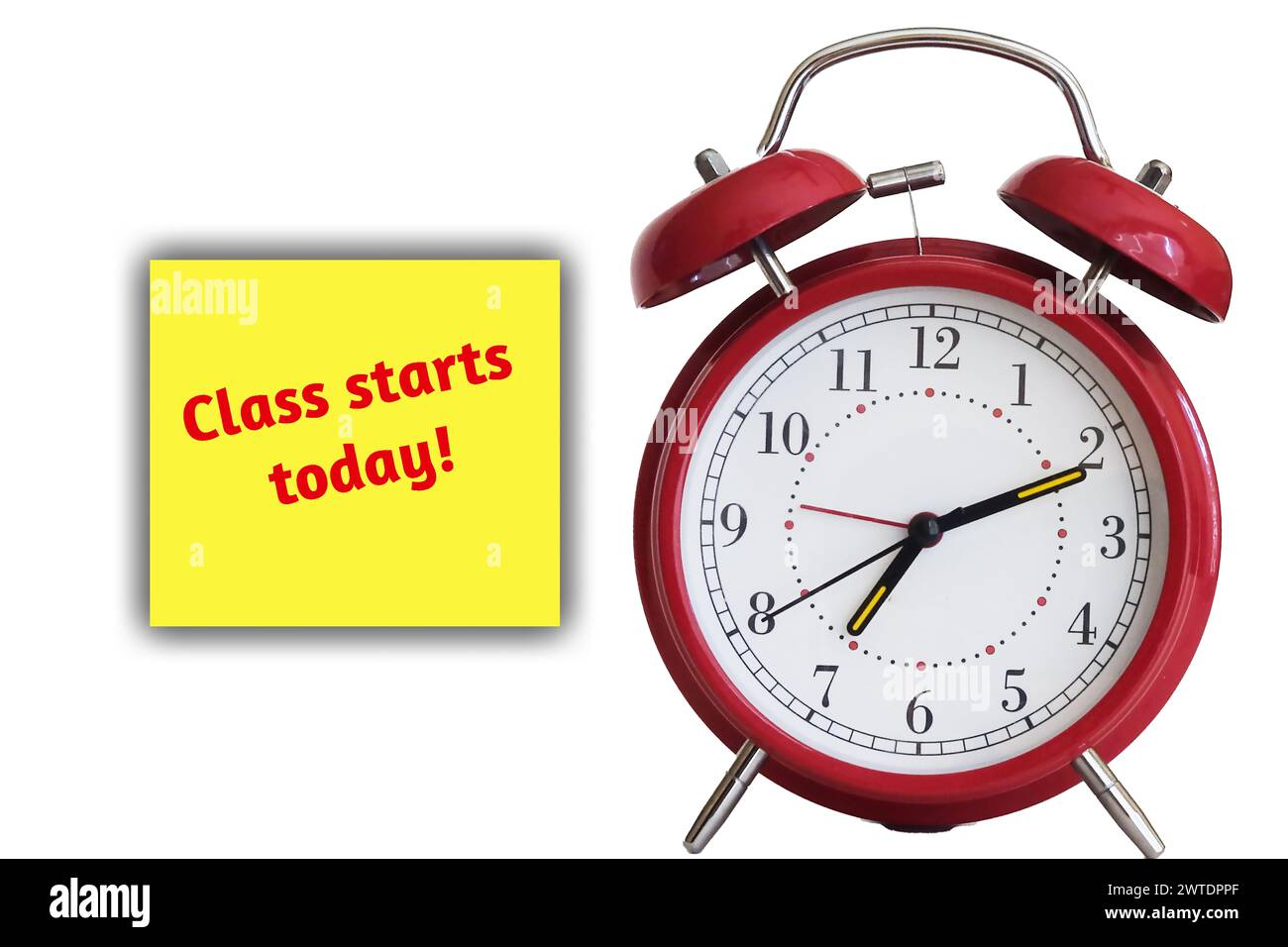 A Vintage red alarm clock with a class starts today sticker Stock Photo ...