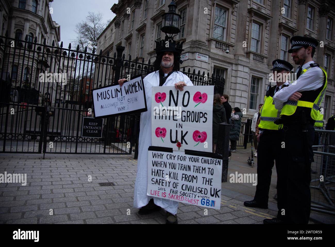 London, UK. 16th Mar, 2024. A protestor holds placards during the UN ...