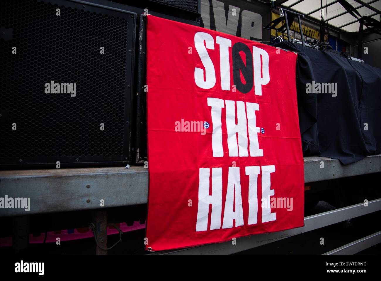 A large banner is displayed on the music sound system truck during the ...