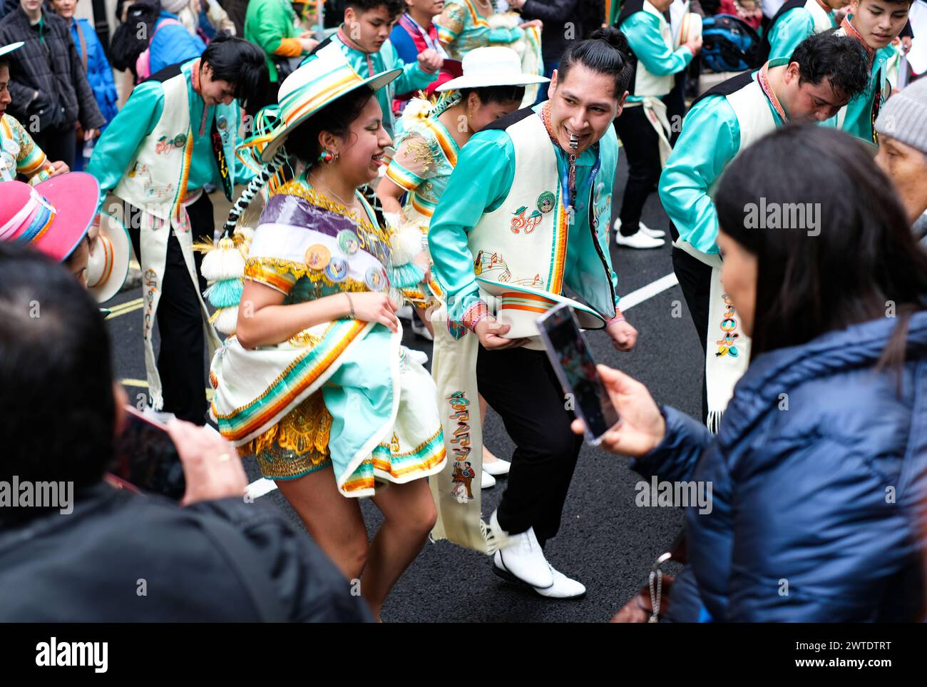 London, United Kingdom. 17th Mar, 2024. Bolivian dancers wear colourful ...