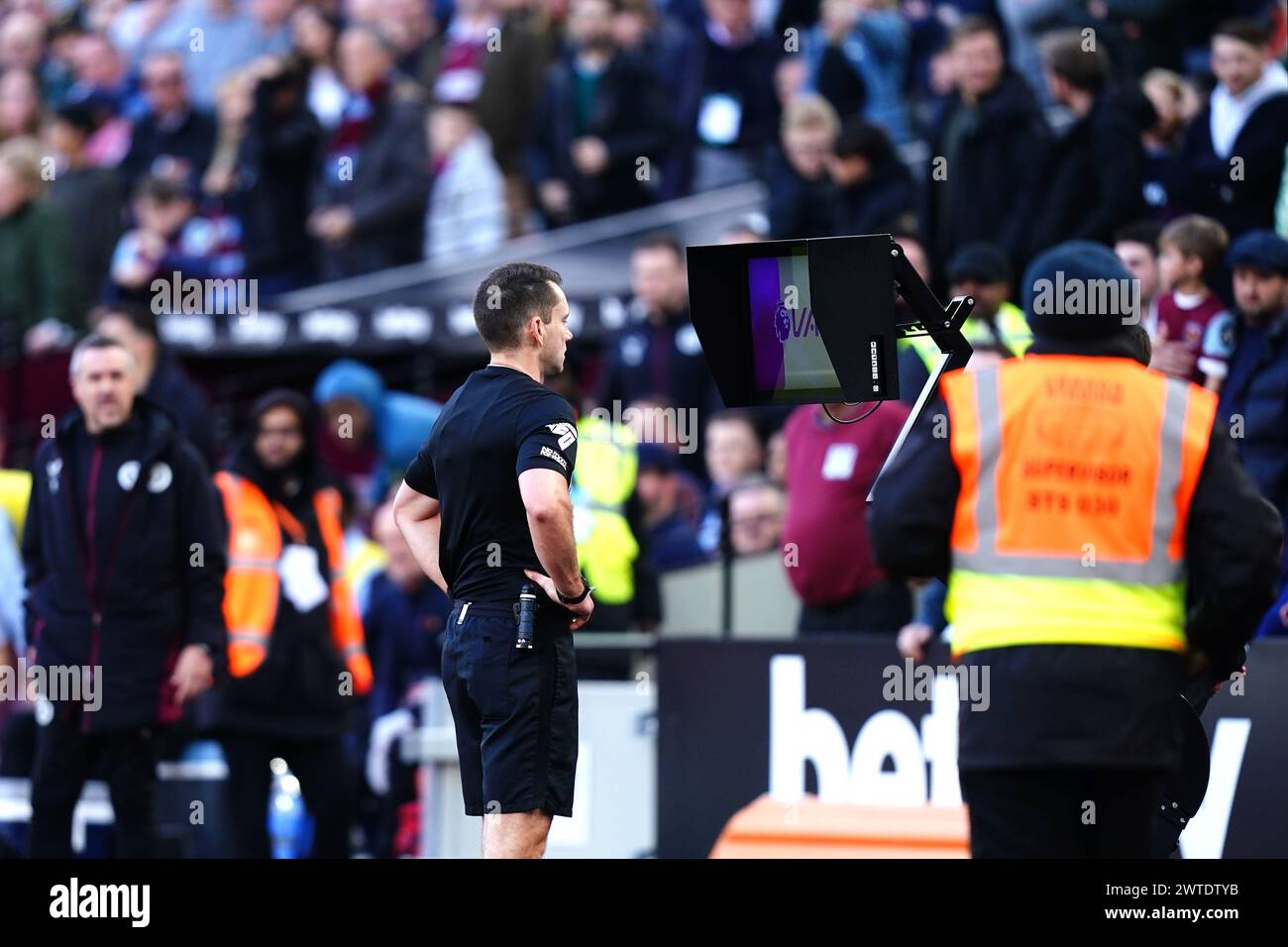 Referee Jarred Gillett checks a goal with VAR during the Premier League ...