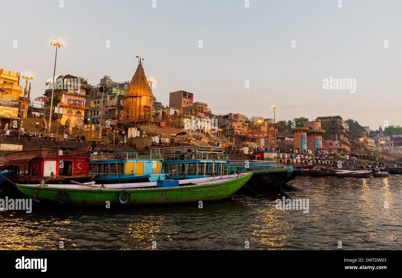 Wooden boats at Iat riverbank of sacred Ganges river in the morning ...
