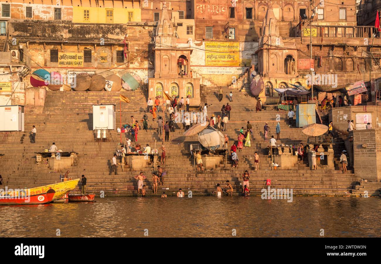 India people at the ghats and riverbank of sacred Ganges river for ...